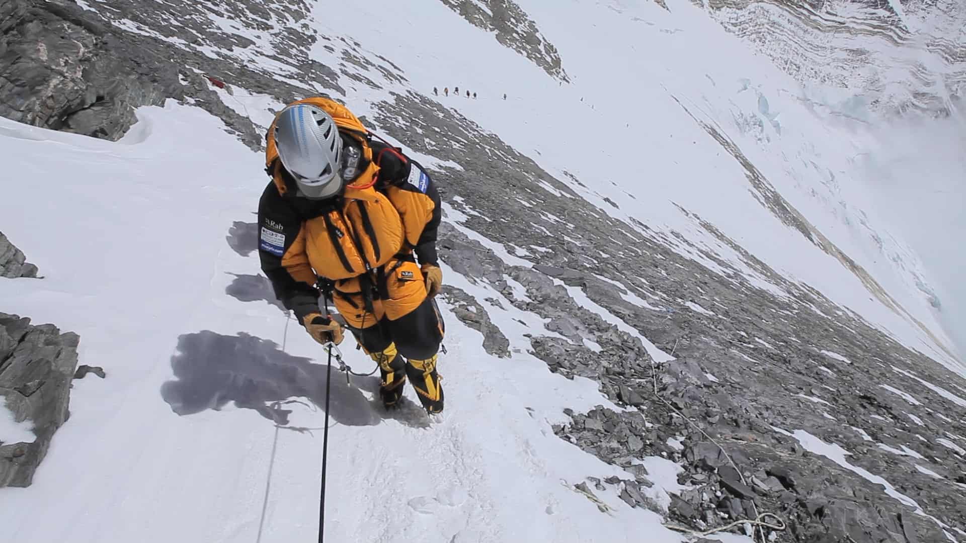 Climber on the Geneva Spur with fixed line - Elia Saikaly Licensing