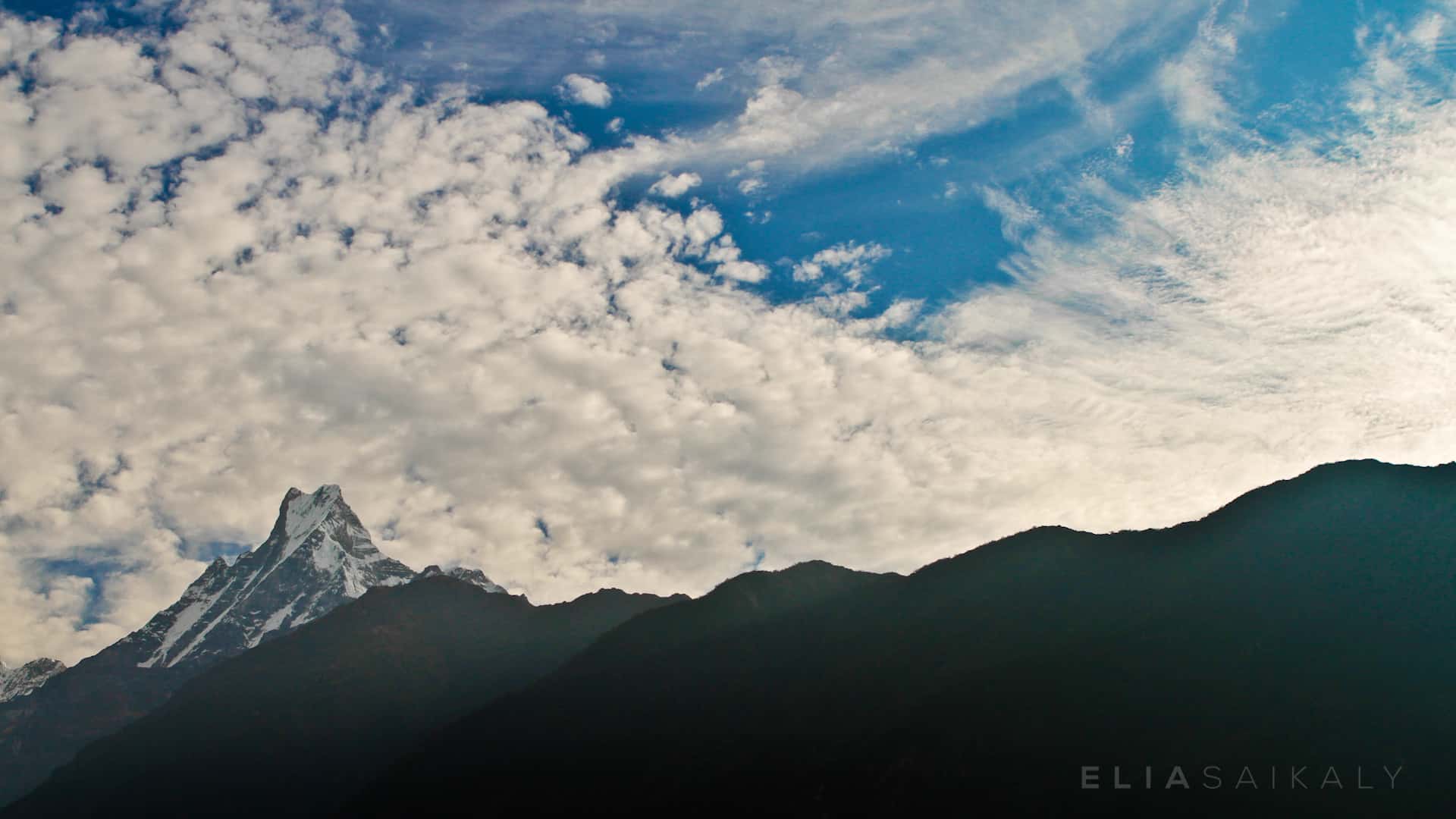Fishtail mountain with stunning cloud formations - Elia Saikaly Licensing